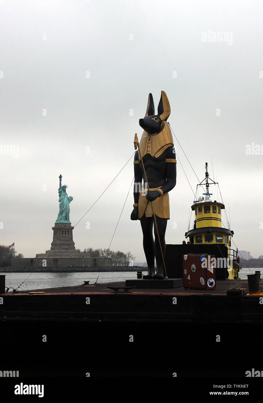 A 25-foot tall, 7 ton replica statue of the Egyptian God Anubis passes ...