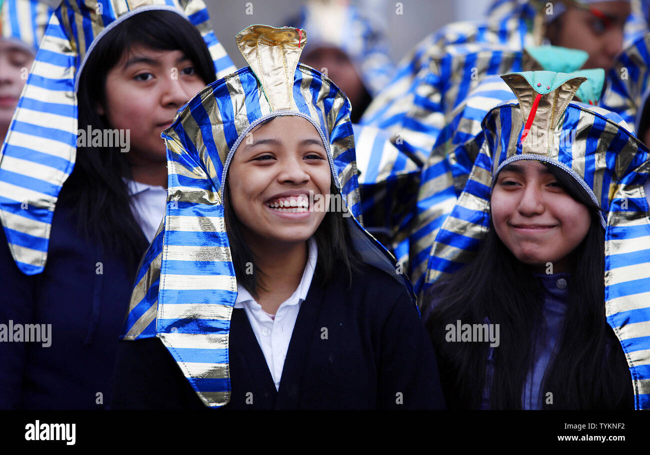 Public School Children wearing Tut hats watch a 25-foot tall, 7 ton ...