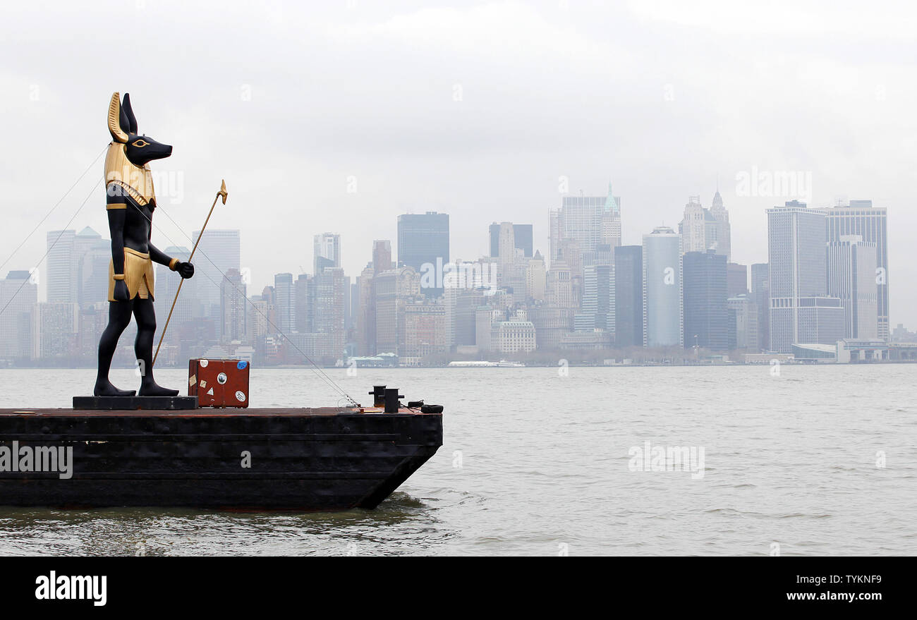 A 25-foot tall, 7 ton replica statue of the Egyptian God Anubis passes ...
