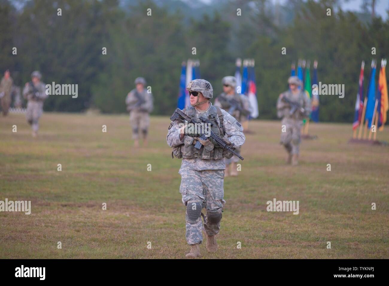 A 3rd Infantry Division infantry squad participates in Twilight Tattoo ...