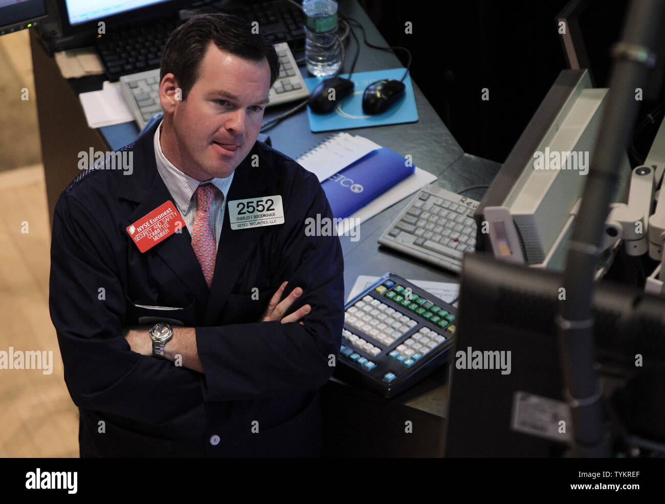 Wall Street employes are busy working moments before the opening bell ...