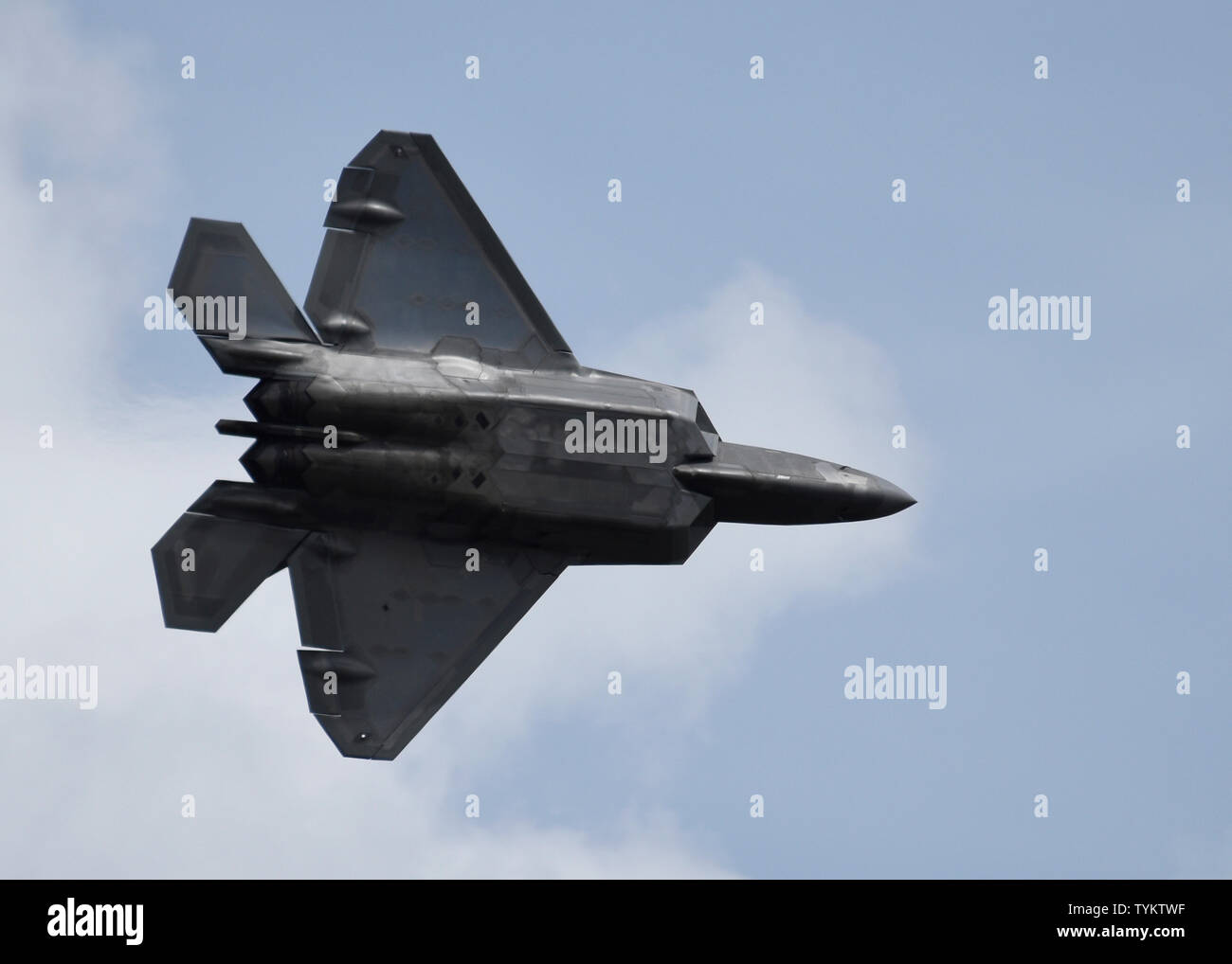 An F-22 Raptor from the F-22 Raptor demonstration team performs aerial ...