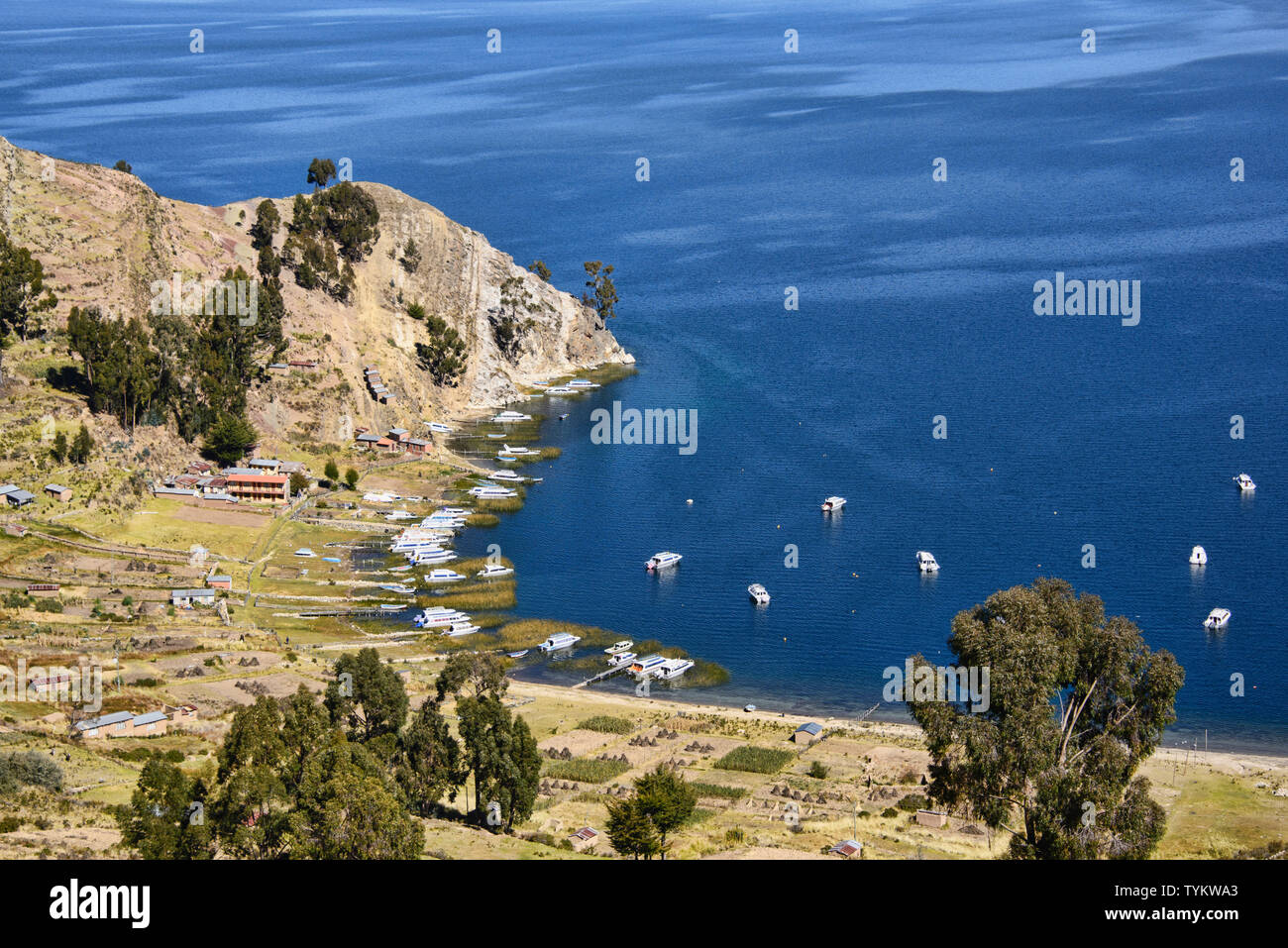 Boats in the Playa Japapi bay on Isla del Sol, Lake Titicaca, Bolivia ...