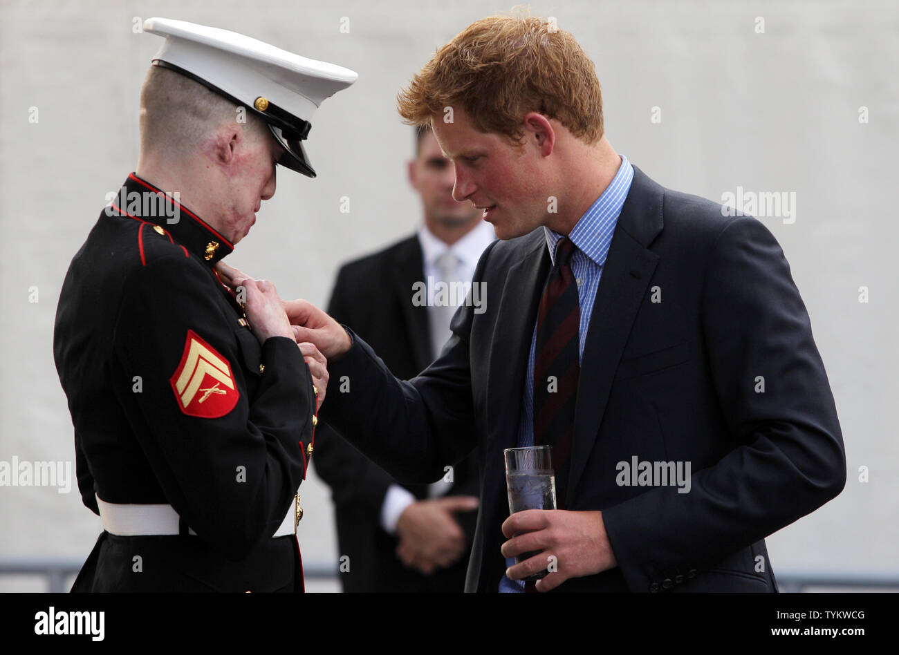 Britain's HRH Prince Harry (R) speaks with U.S. Marine veteran Aaron ...