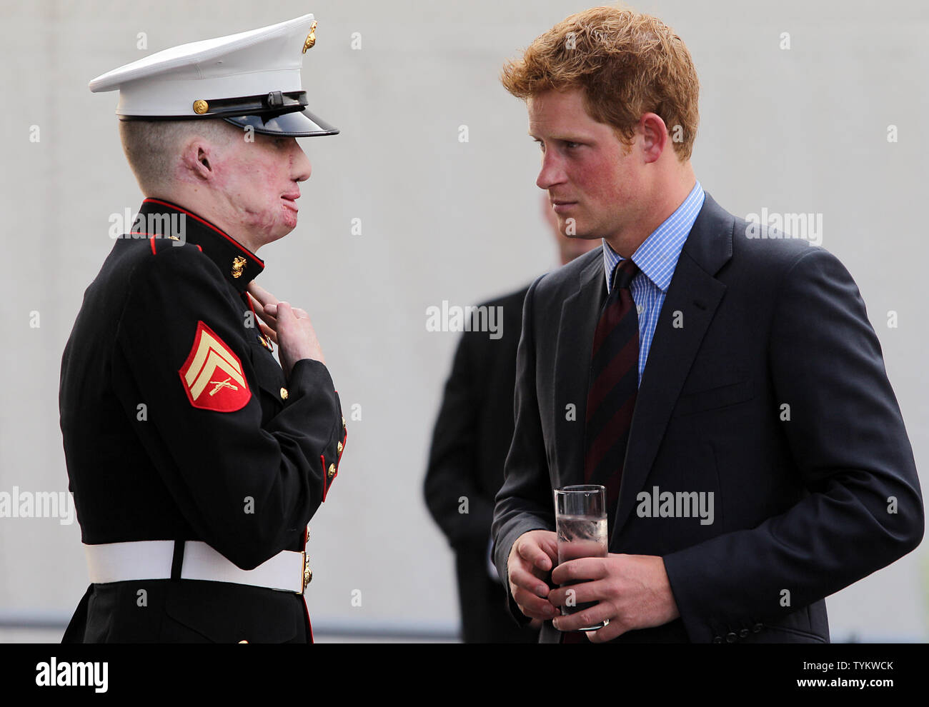 Britain's HRH Prince Harry (R) speaks with U.S. Marine veteran Aaron ...