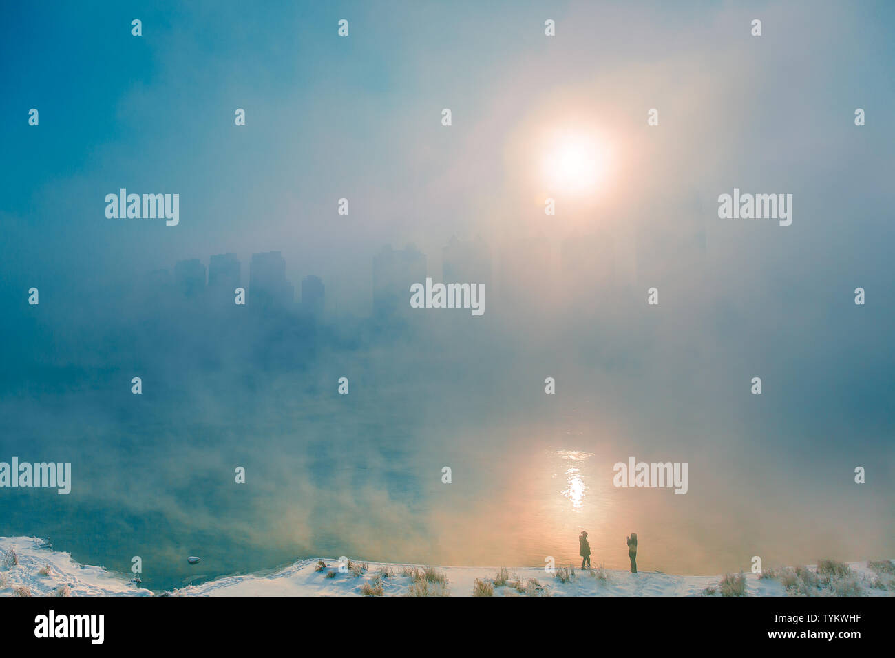A city looming in the winter fog Stock Photo - Alamy