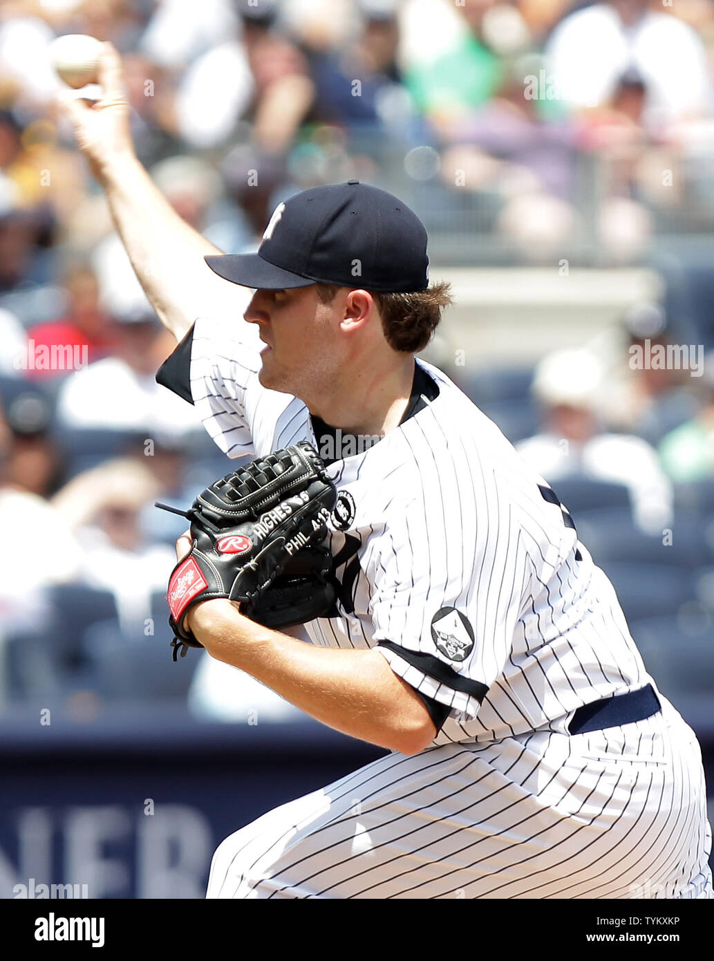 New York Yankees starting pitcher Phil Hughes throws a pitch in the ...