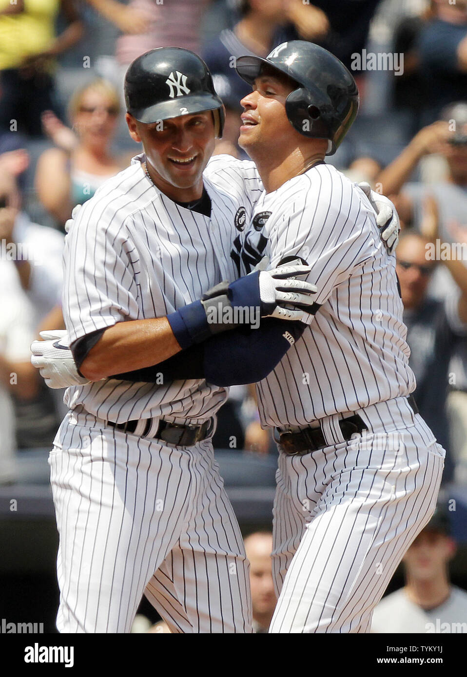 New York Yankees Alex Rodriguez reacts with Derek Jeter after hitting his career 600th home run ...