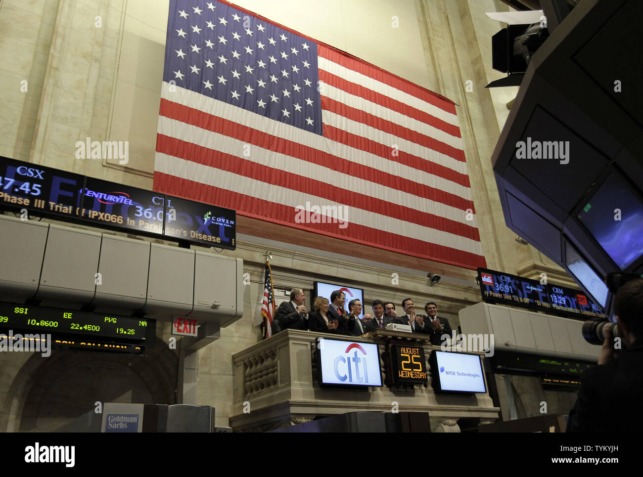 Citi Group employes ring the opening bell on the floor of the NYSE on ...
