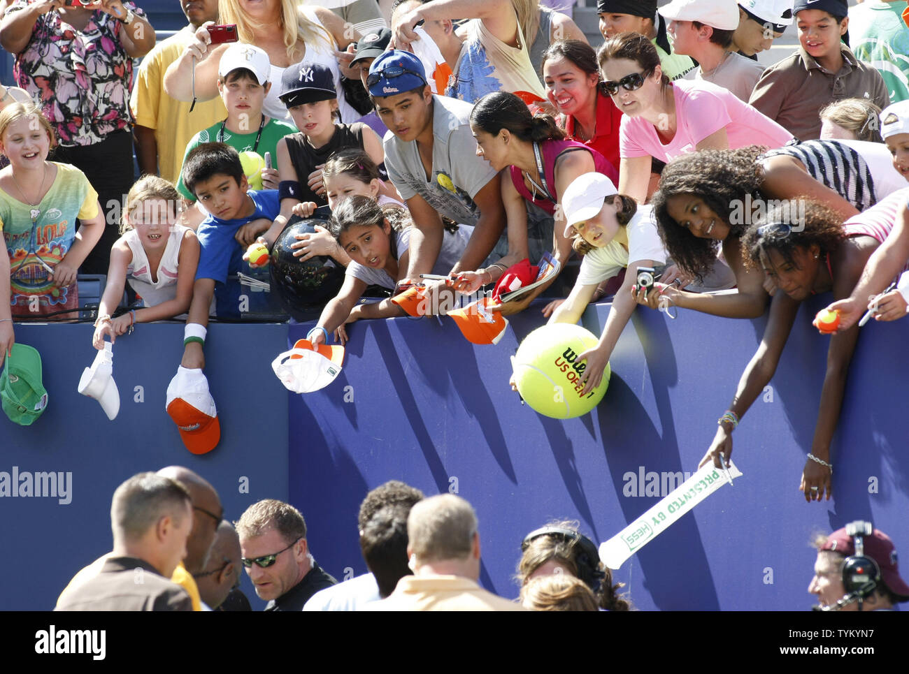 Young fans of Joe Jonas of the The Jonas Brothers try to get his ...