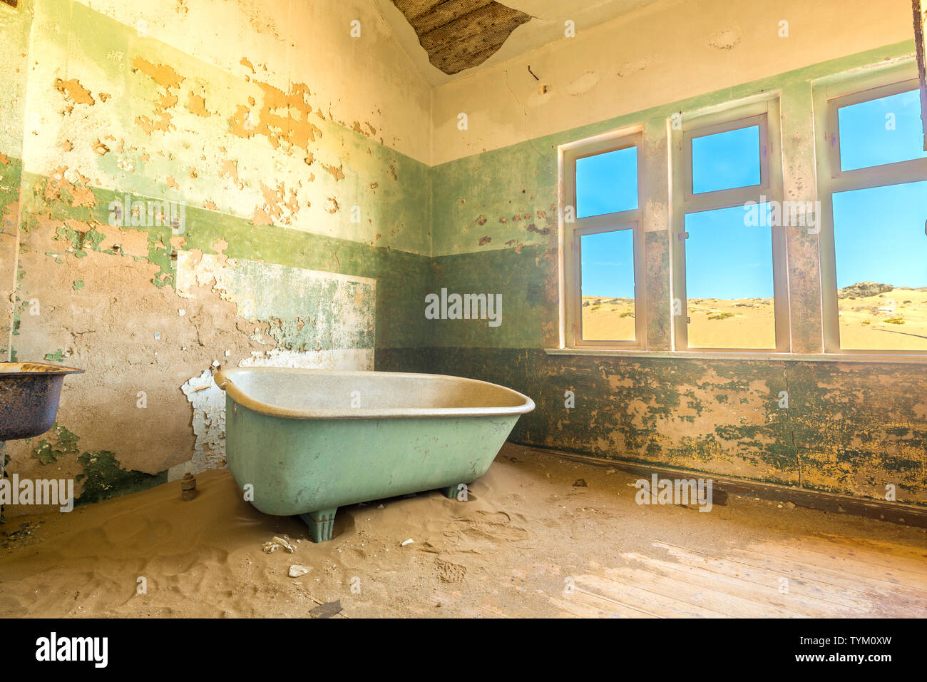 Bathroom filled with desert sand Stock Photo - Alamy