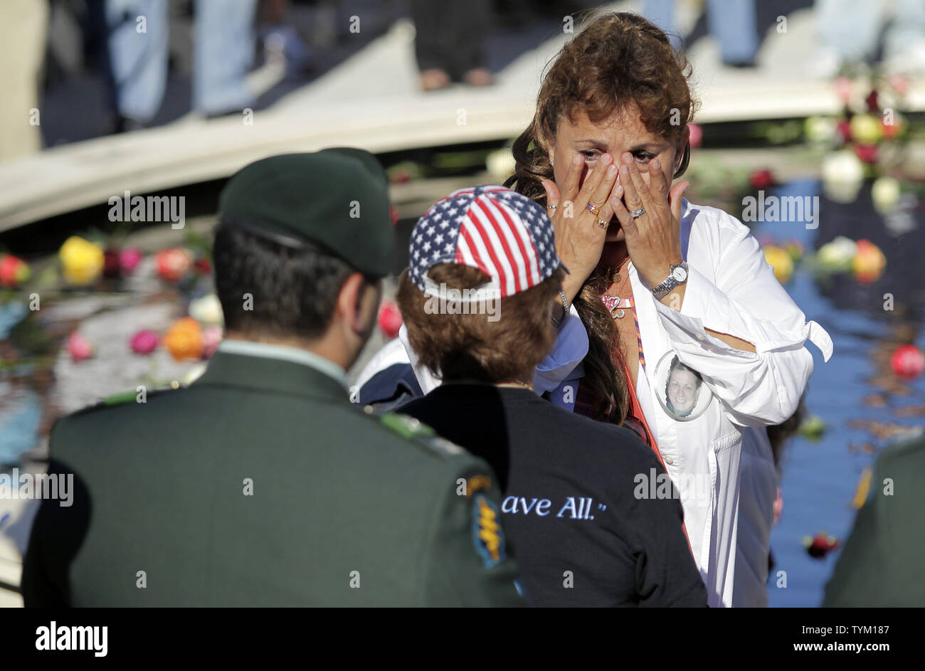 Family members of the victims of 9/11 gather around the Ground Zero ...