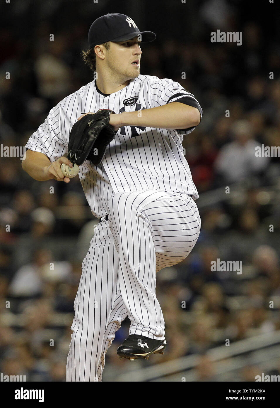 New York Yankees starting pitcher Phil Hughes throws a pitch in the ...