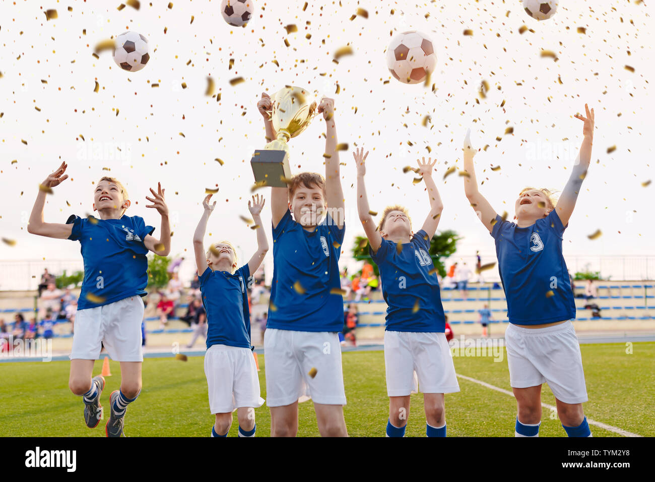 Boys soccer team celebrating trophy hi-res stock photography and images ...