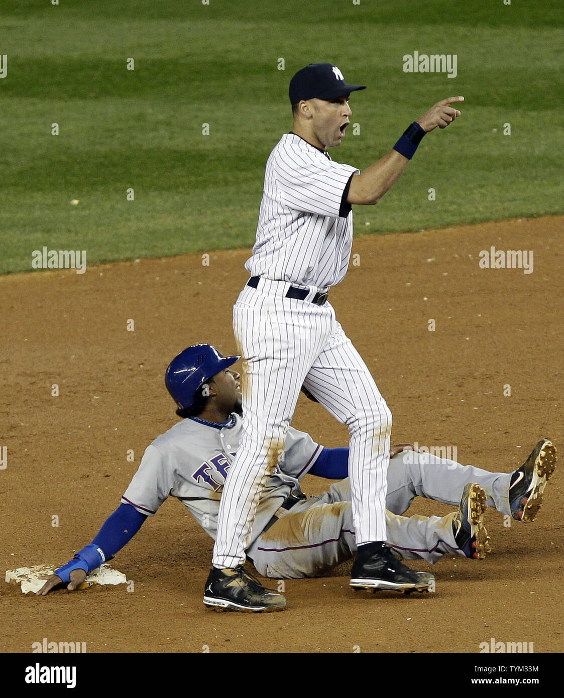 New York Yankees Derek Jeter reacts when Texas Rangers Elvis Andrus is ...