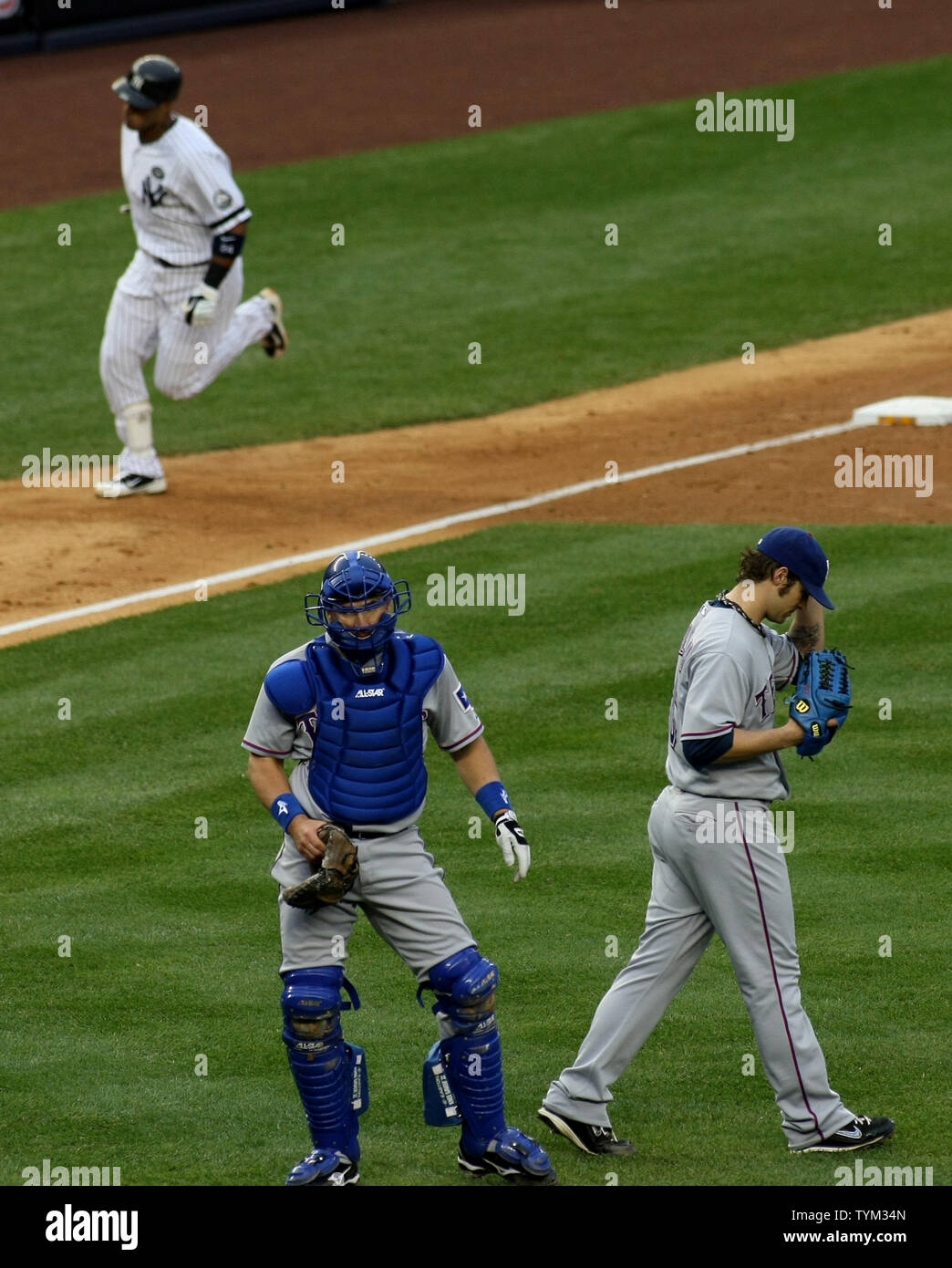New York Yankee Robinson Cano rounds the bases as Texas Rangers ...