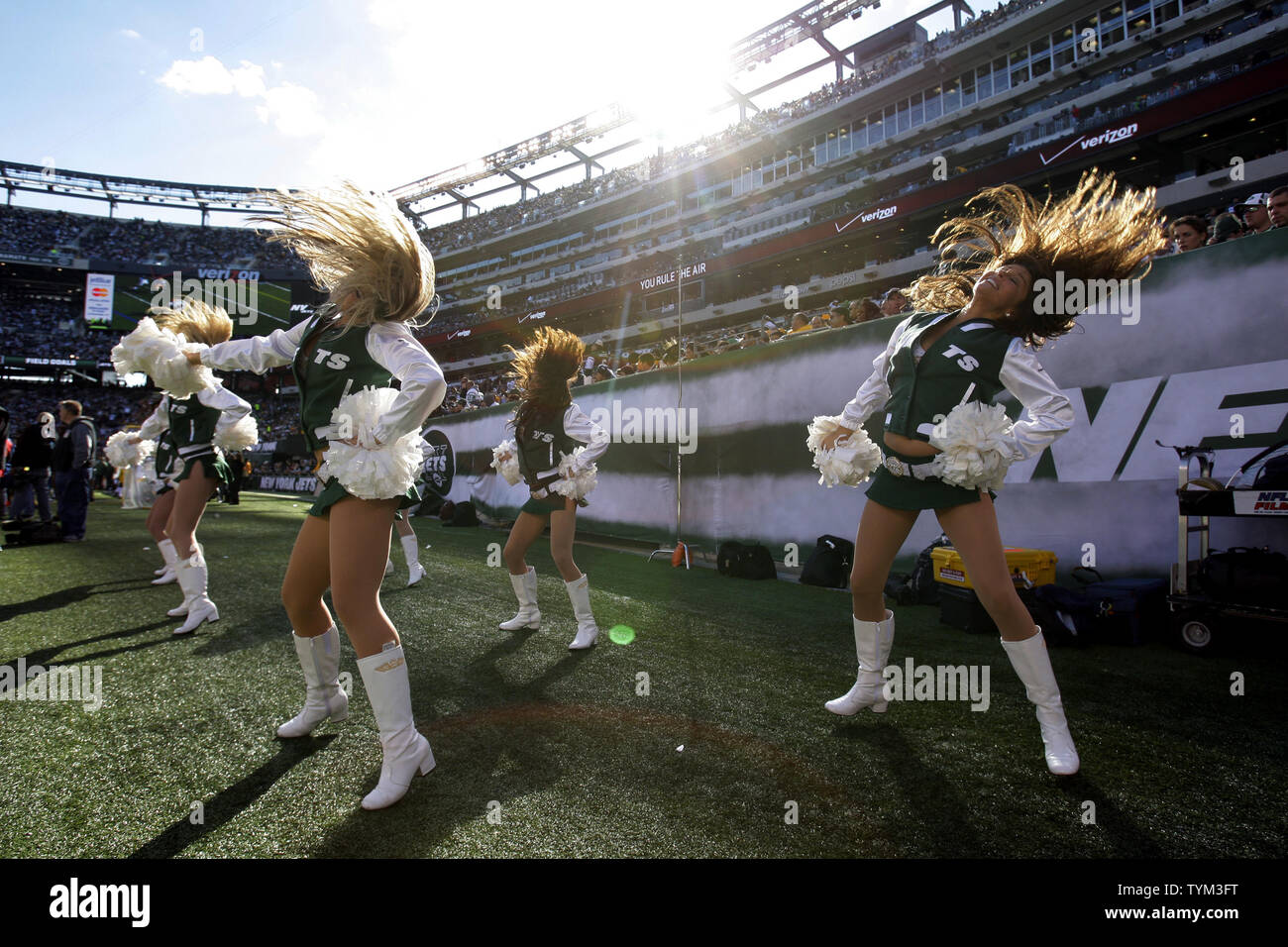The New York Jets Flight Crew Cheerleaders perform as the Green Bay ...