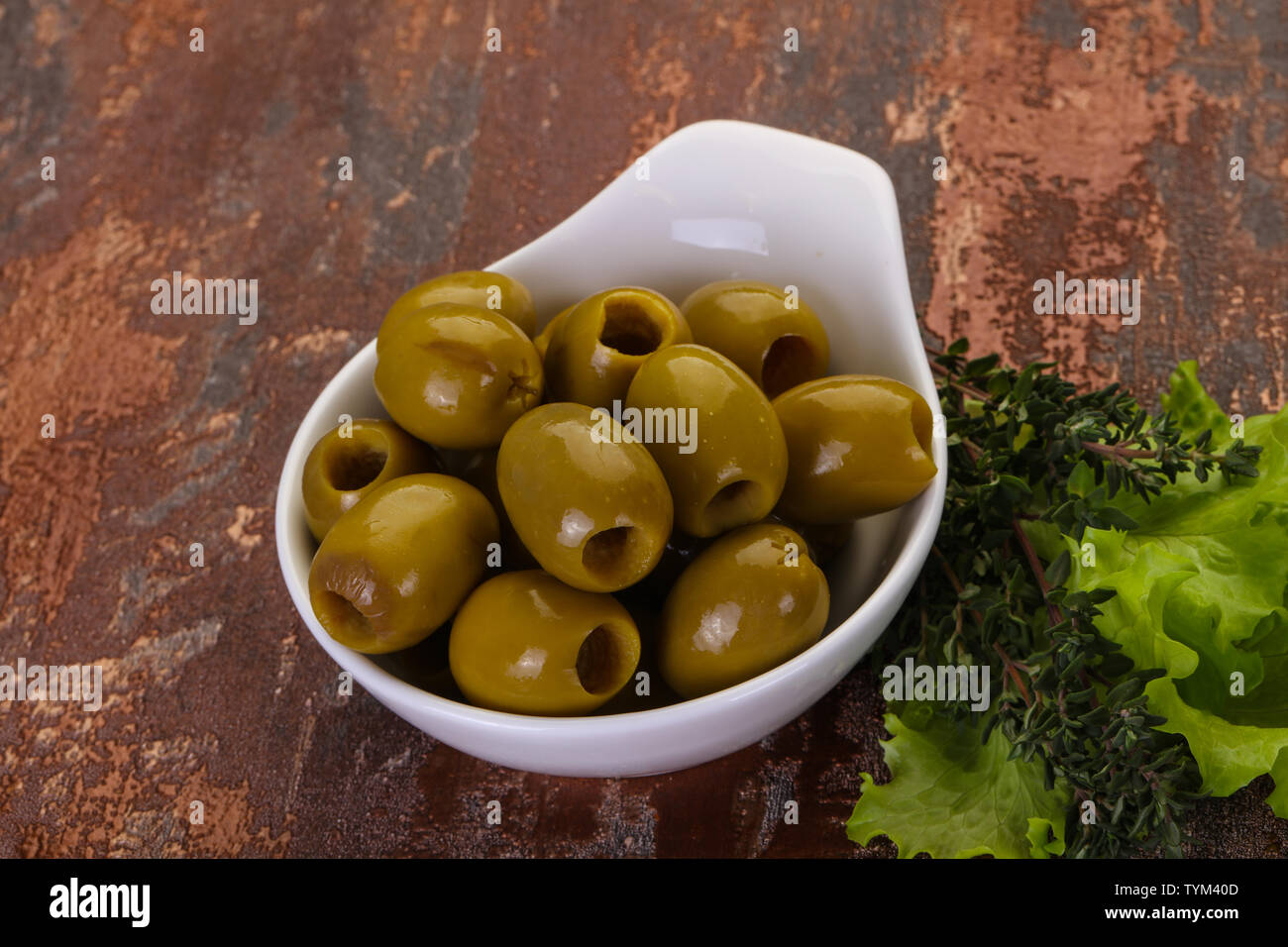 Big green olives in the bowl Stock Photo - Alamy