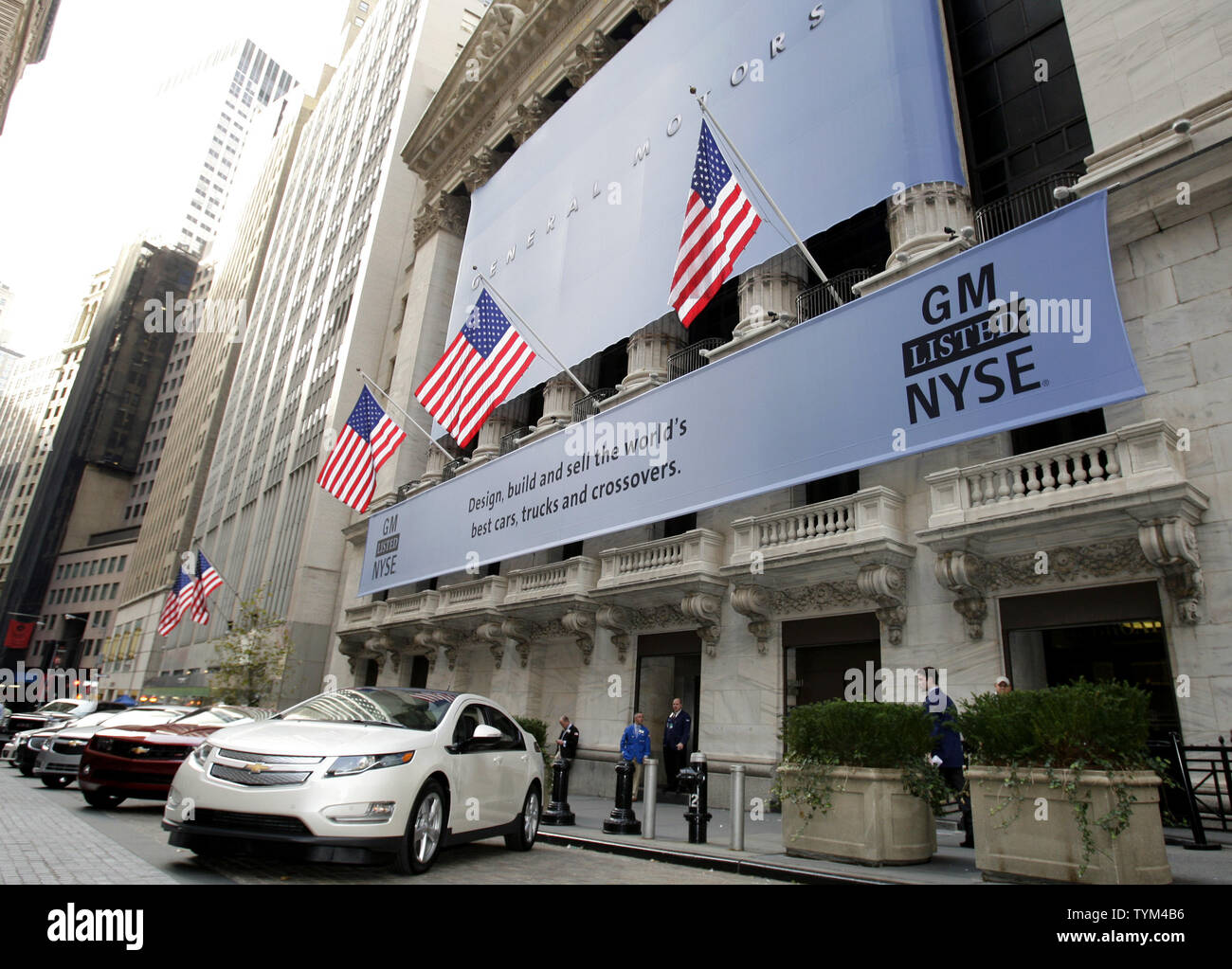 GM brand cars and logos are on display the day after its initial public ...