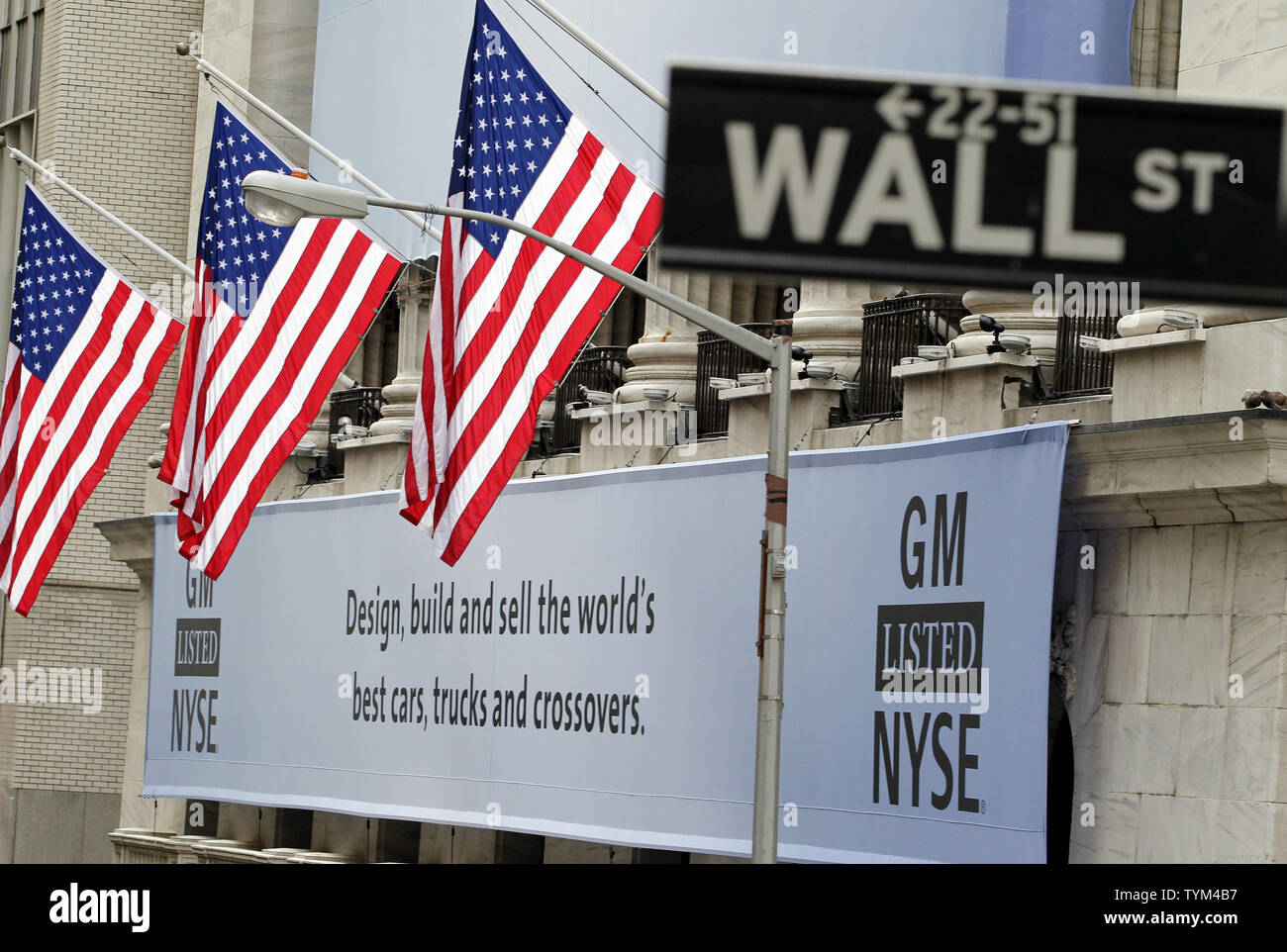 GM brand cars and logos are on display the day after its initial public ...