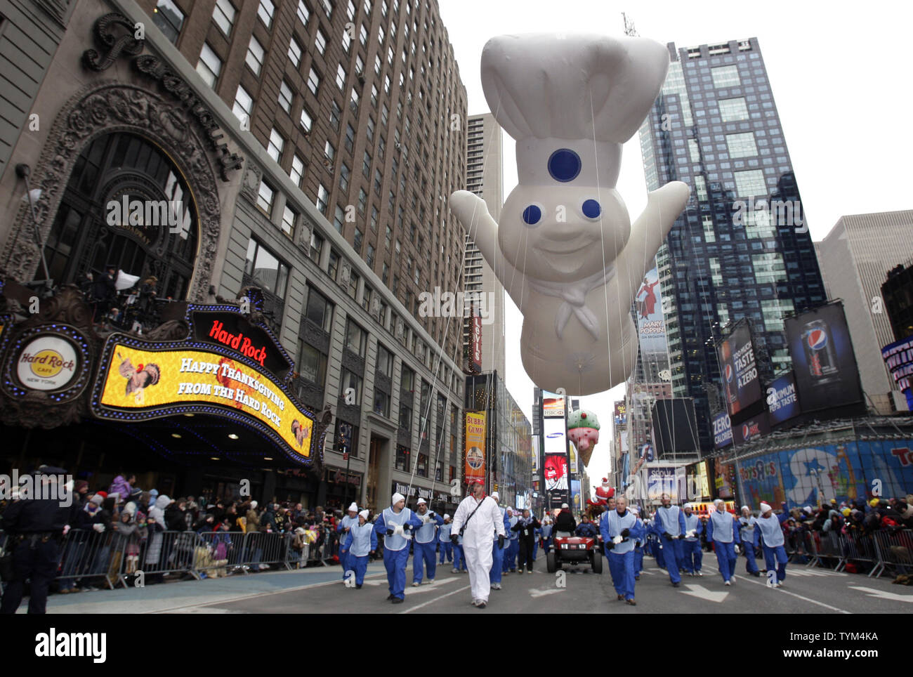 The Pillsbury Doughboy balloon floats down the parade route at the Macy ...
