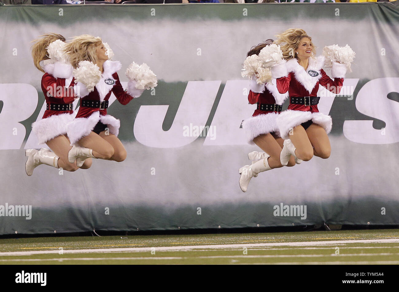 The New York Jets Flight Crew Cheerleaders perform as the Miami ...
