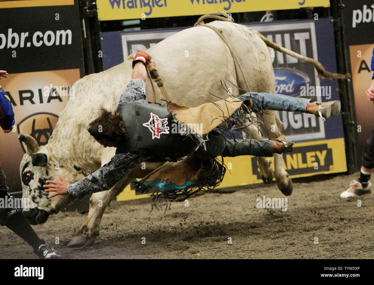 Ben Jones is thrown from his bull during the fifth annual Professional ...