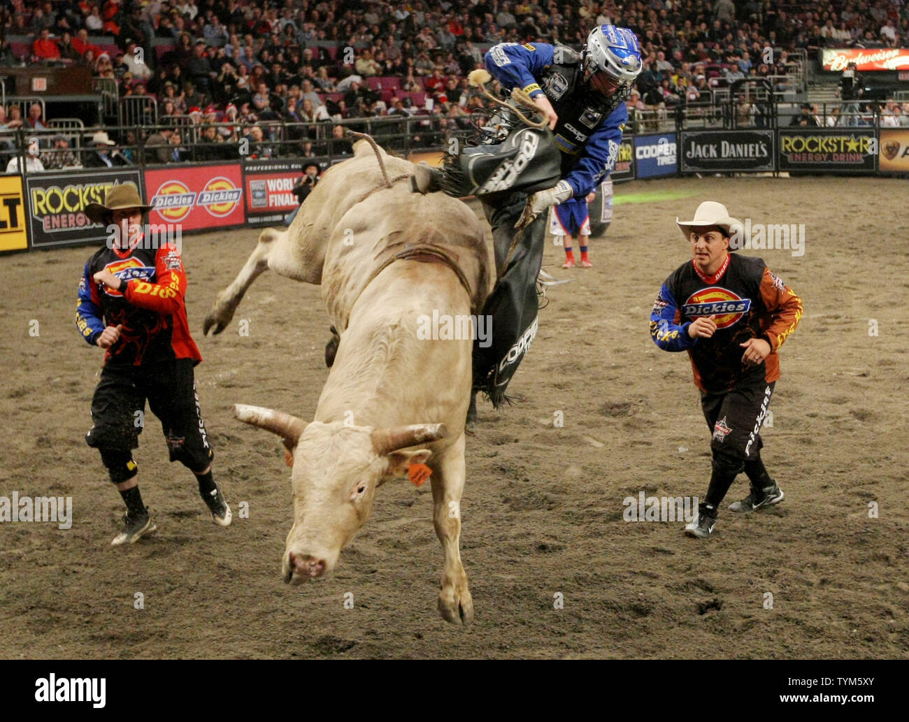 Skeeter Kigsolver (C) is thrown from his bull during the fifth annual ...