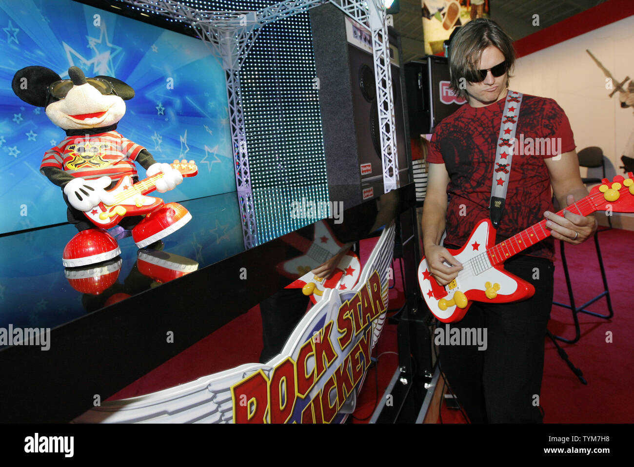 Gustaf Farwell plays along with Rock Star Mickey at the the 108th ...