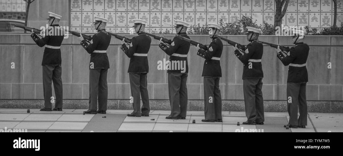 U.S. Marines with Marine Barracks Washington preform a rifle salute ...