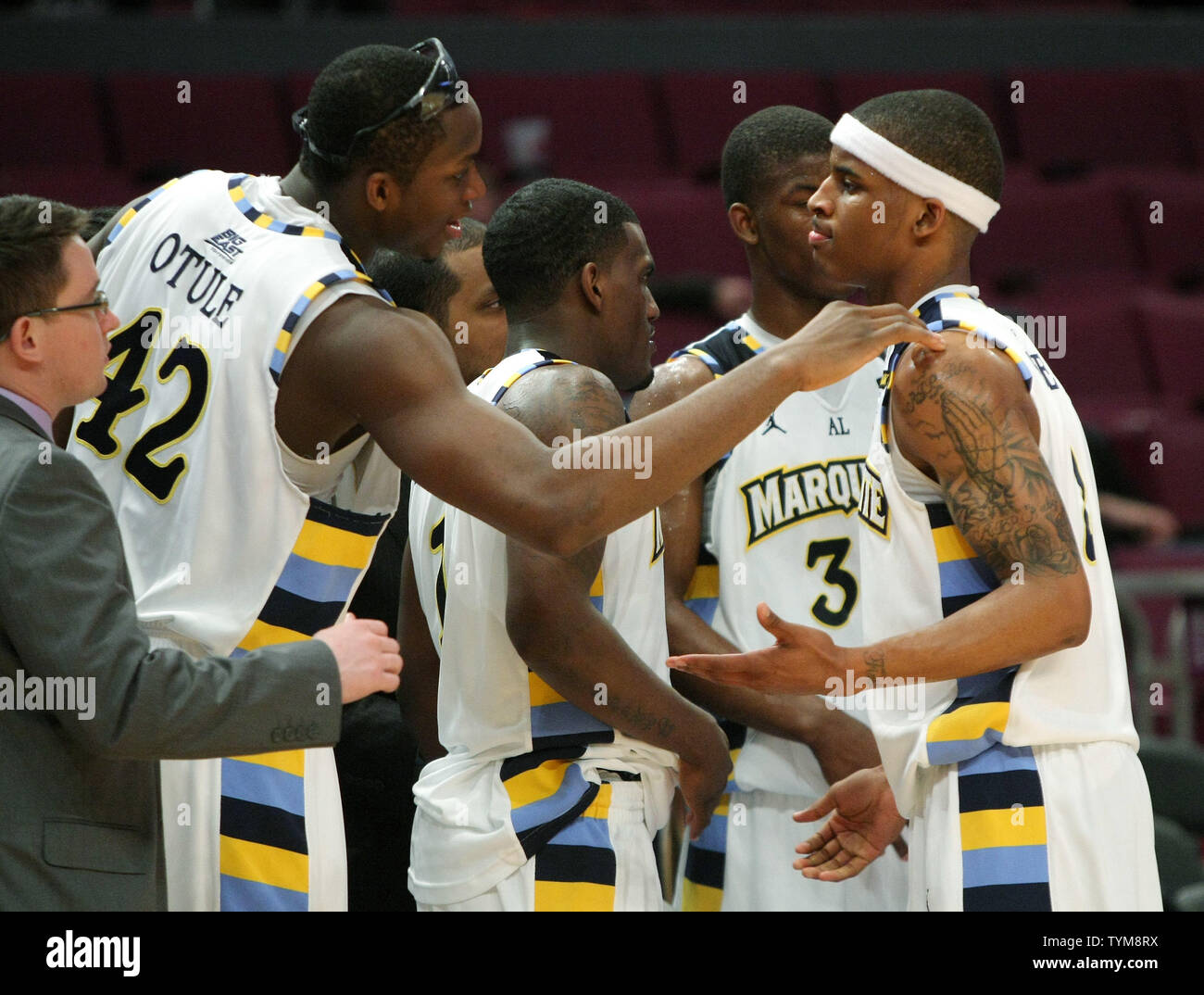 Marquette's Chris Otule (L) congratulates Vander Blue after defeating ...