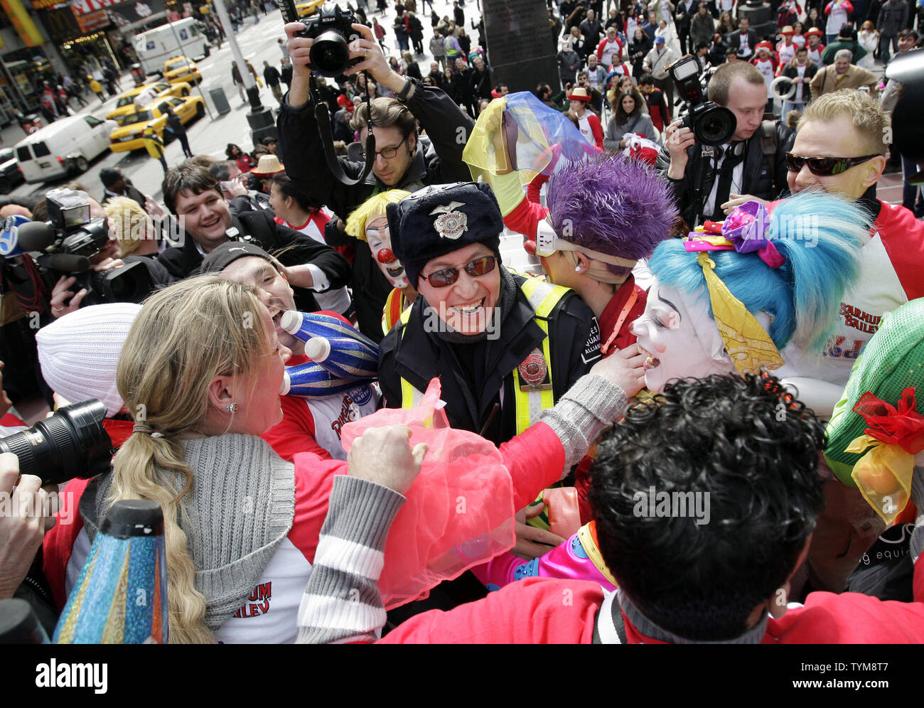 Clowns from Ringling Bros. and Barnum & Bailey Circus surround an NYPD ...