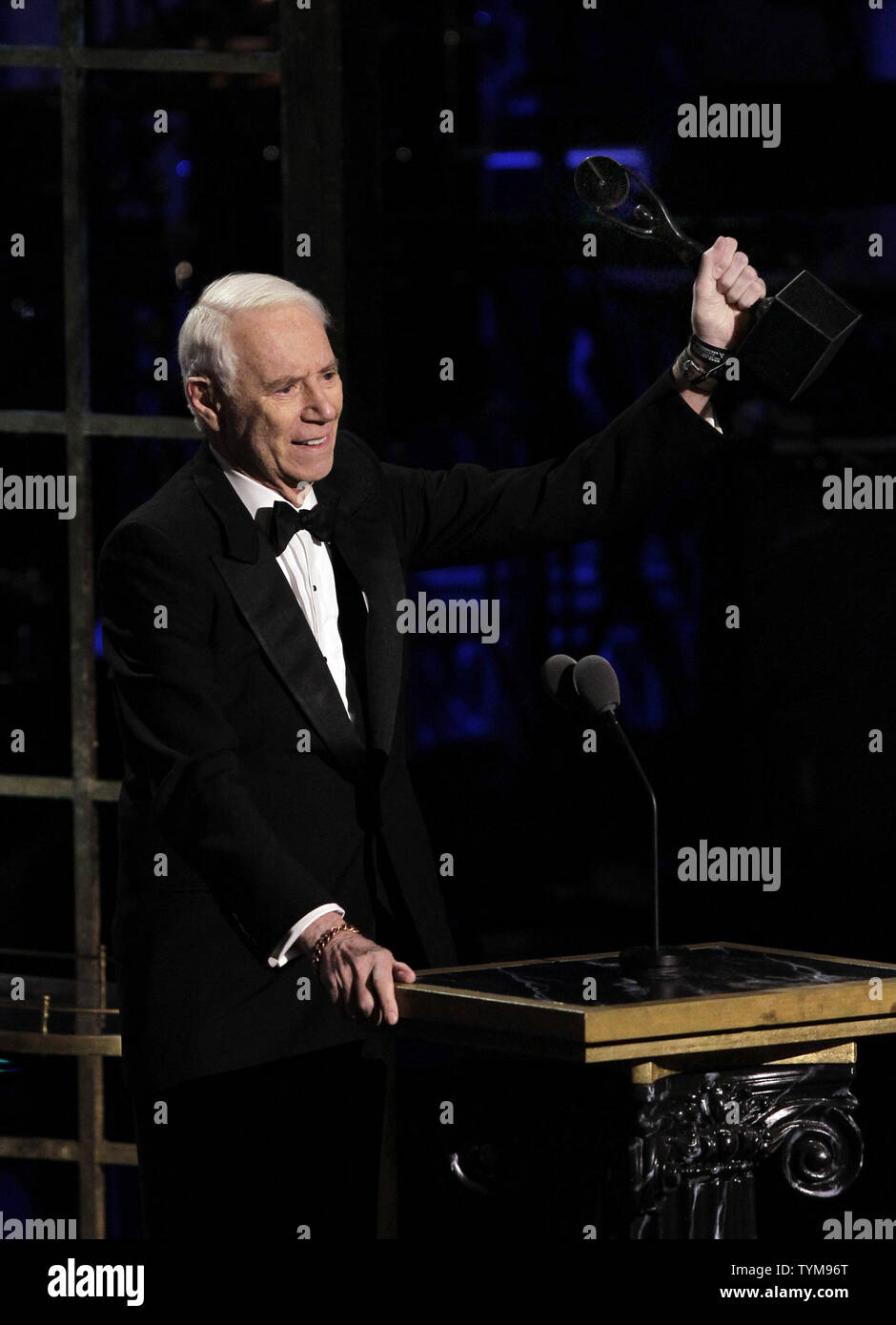 Jac Holzman speaks at the podium after being inducted into the Rock and ...