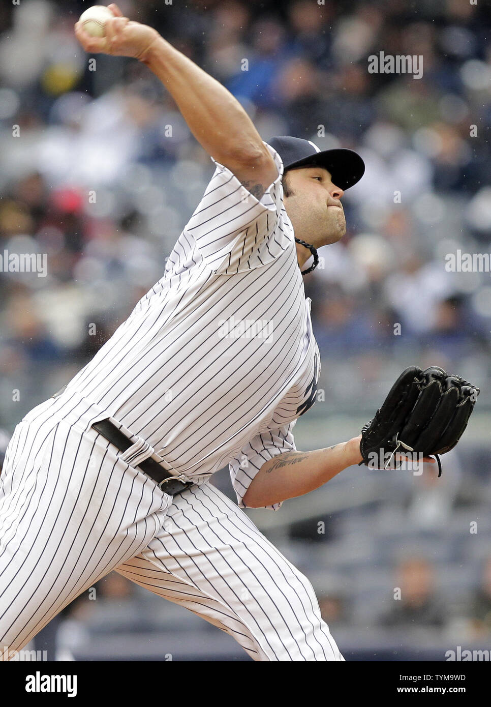 New York Yankees relief pitcher Joba Chamberlain throws a pitch in the ...