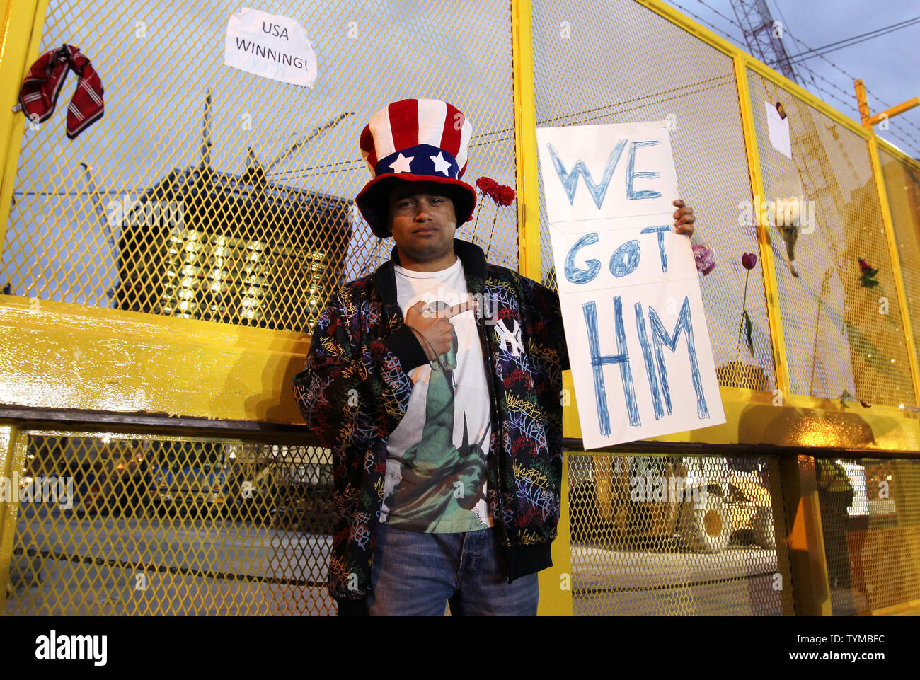 Ray Maldonado holds up a sign at the site of the former Twin Towers ...