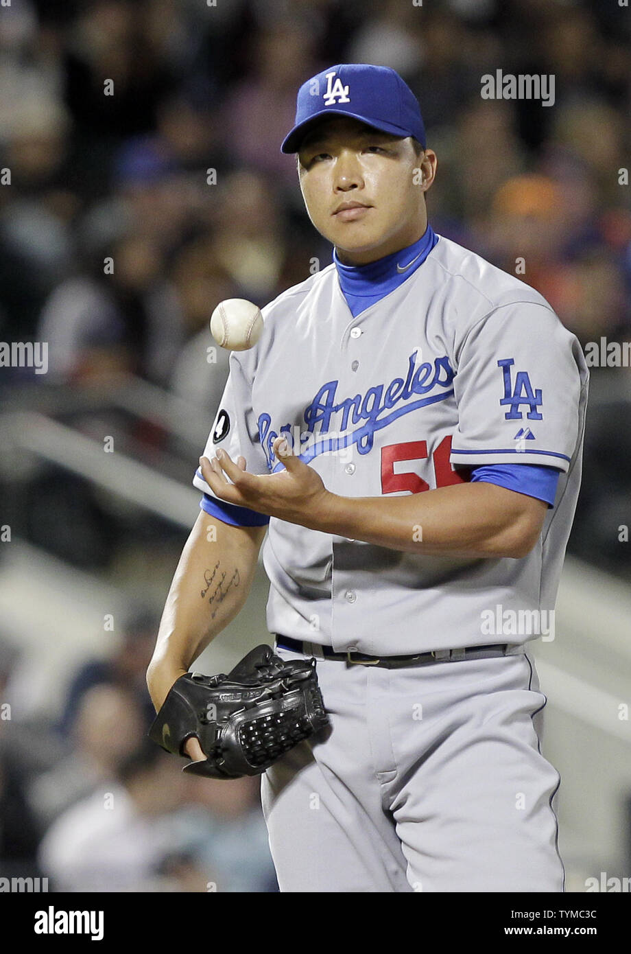 Los Angeles Dodgers relief pitcher Hong-Chih Kuo tosses the baseball on ...