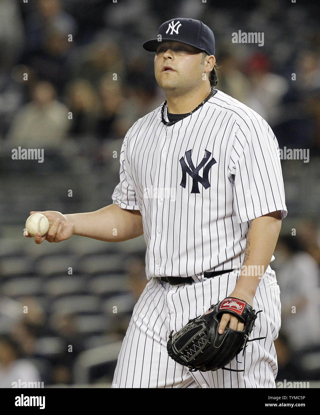 New York Yankees relief pitcher Joba Chamberlain reacts after giving up ...