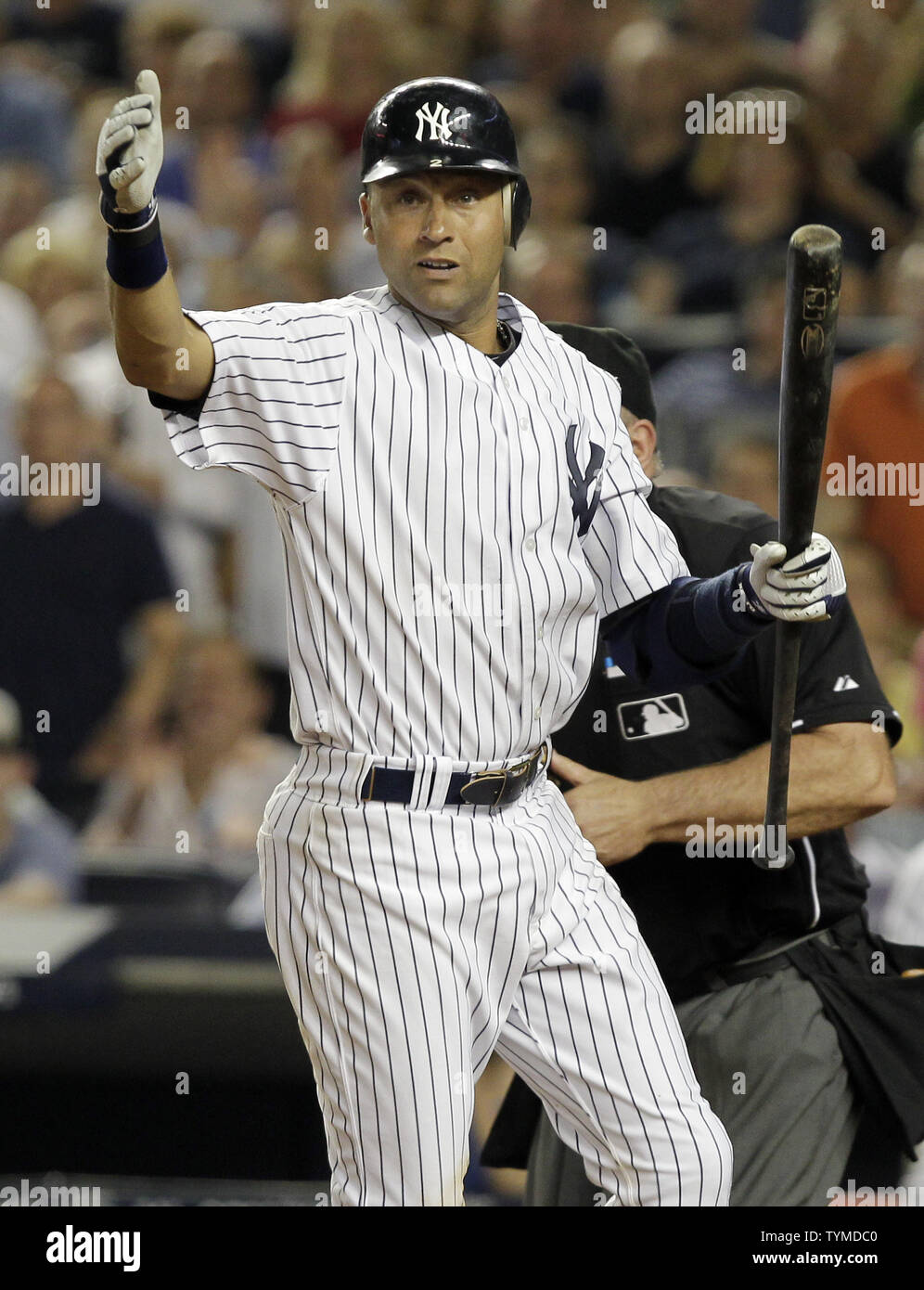 New York Yankees Derek Jeter motions for Eduardo Nunez to come home on ...