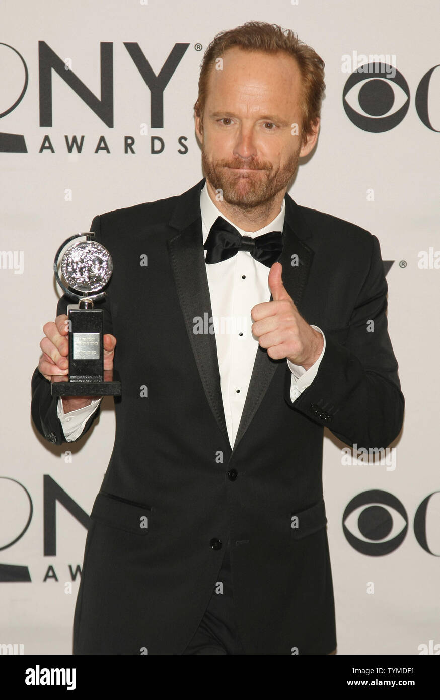 John Benjamin Hickey poses for photographers after winning the Best ...