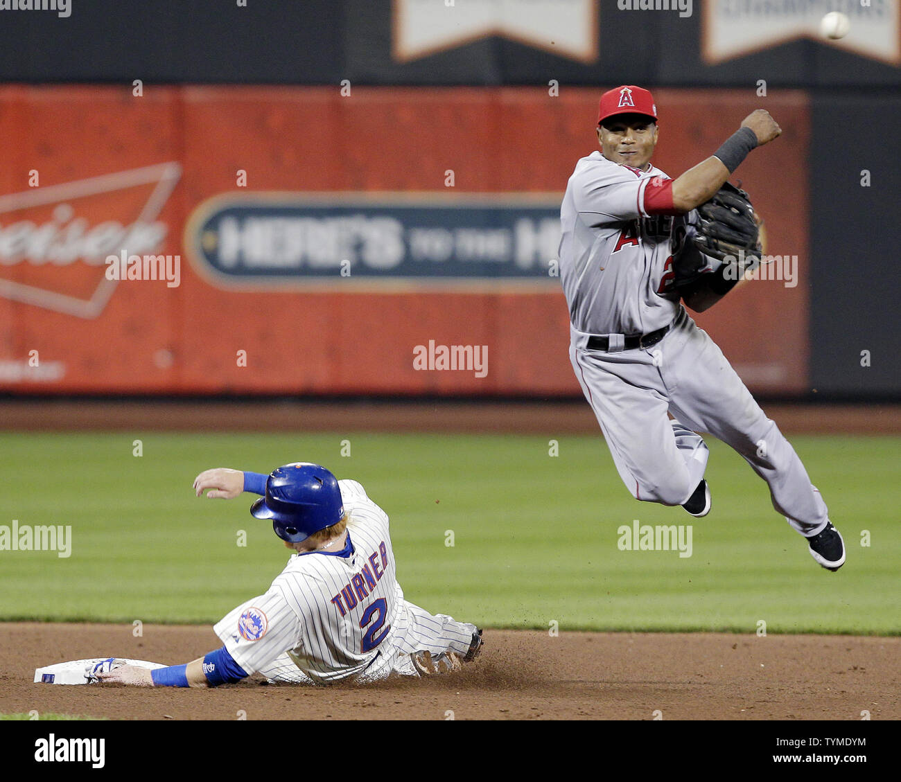 Los Angeles Angels Erick Aybar throws to first base trying to complete ...