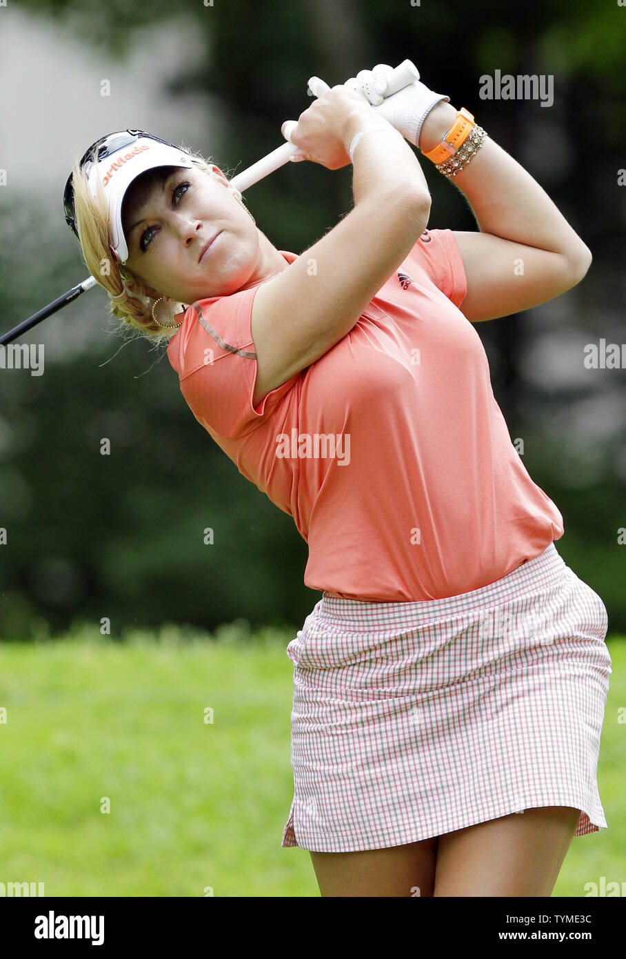 Natalie Gulbis hits her tee shot on the 13th hole in the third round of ...