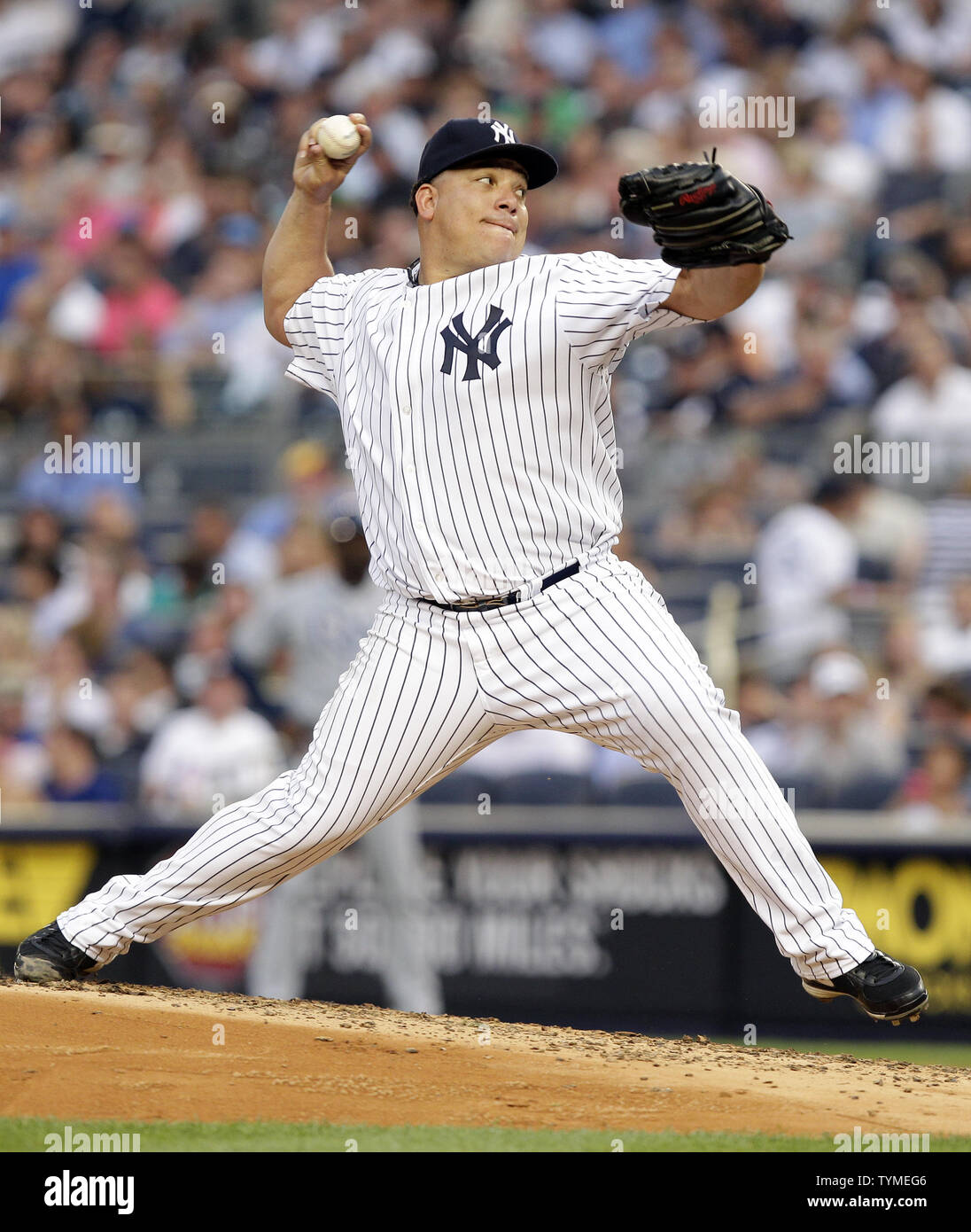 New York Yankees starting pitcher Bartolo Colon throws a pitch in the ...