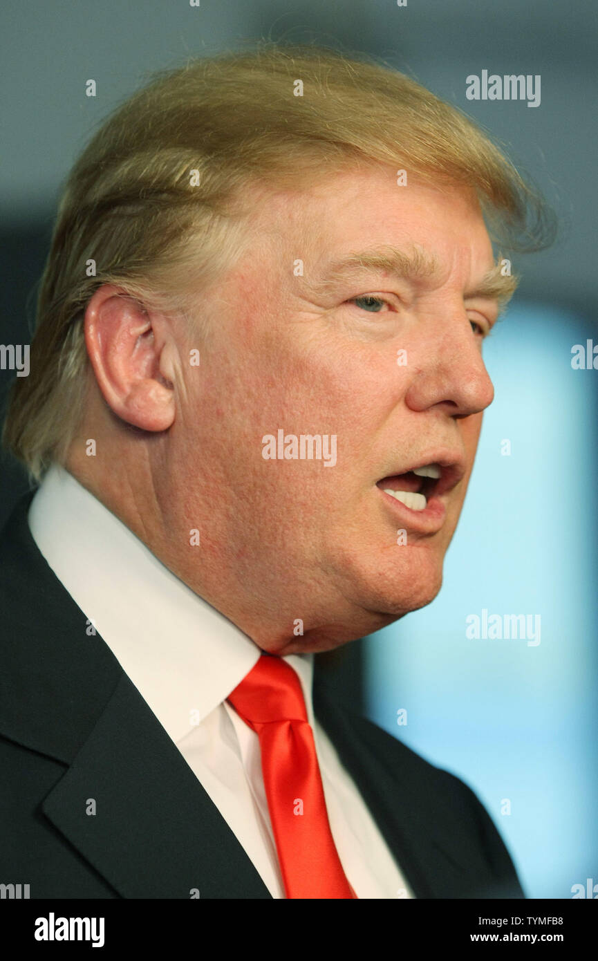 Donald Trump is interviewed by a TV crew after his photo shoot with ...