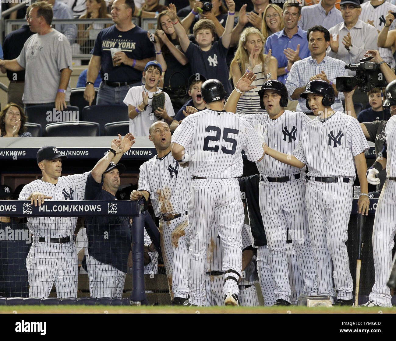New York Yankees manager Joe Girardi and Derek Jeter react after Mark ...