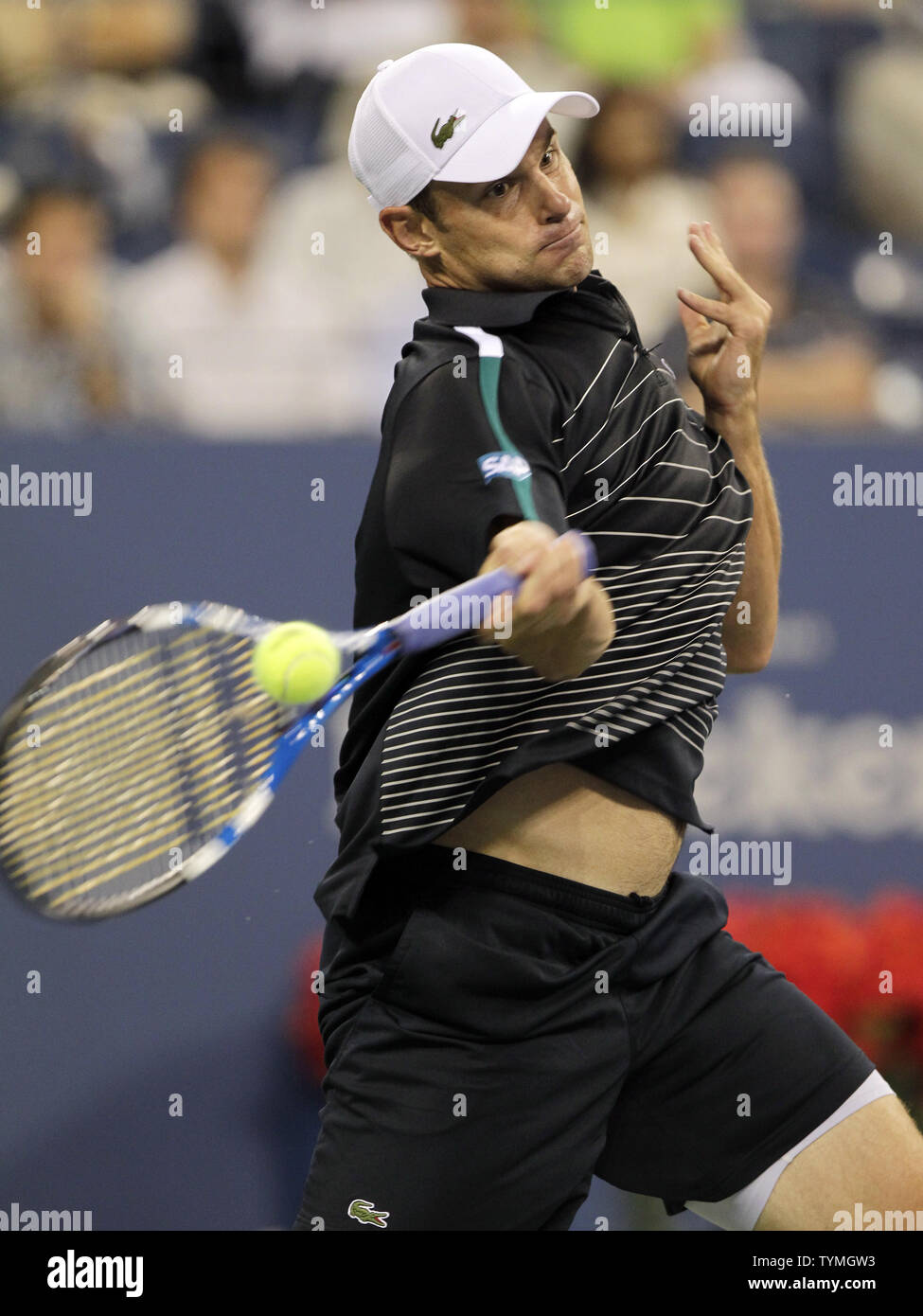 Andy Roddick hits a forehand in his first round match against Michael ...