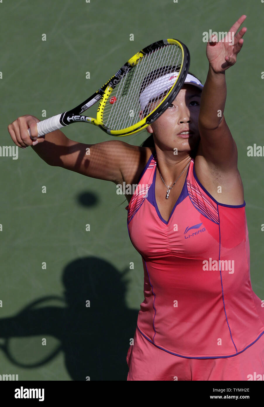 Shuai Peng of China serves to Julia Goerges of Germany on day 5 in the ...