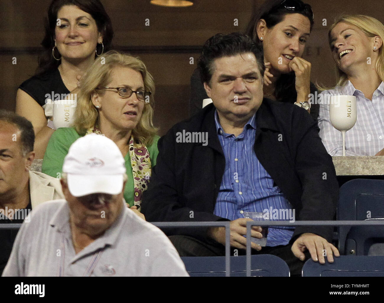 Actor Oliver Platt watches Roger Federer of Switzerland play Jo ...