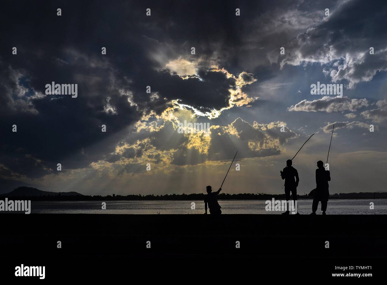 June 26, 2019 - Srinagar, J&K, India - Kashmiri boys seen fishing ...