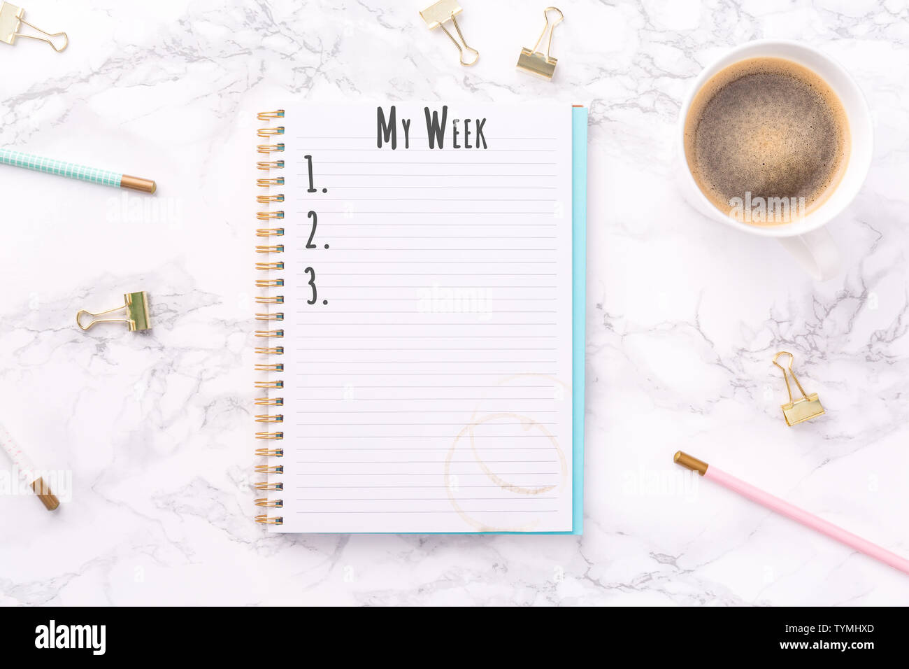 Festive golden stationary and coffee on white marble background. My ...