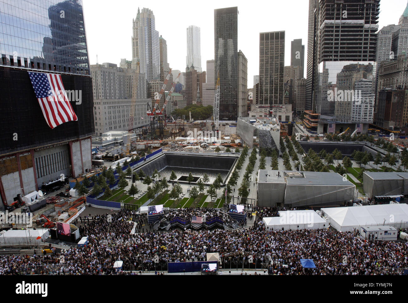 Families wait to visit the Memorial Pools on the tenth anniversary of ...